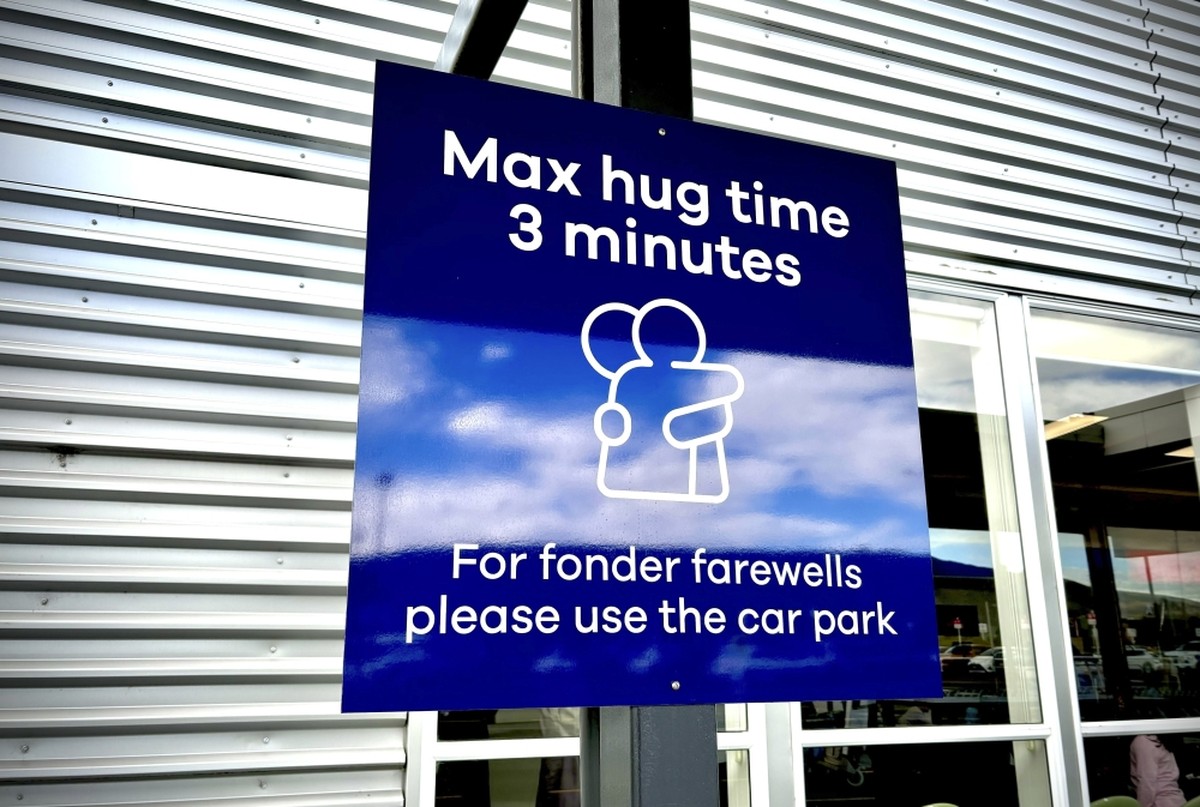 Hug it out, but make it quick. New Zealand airport sets time limit on ...